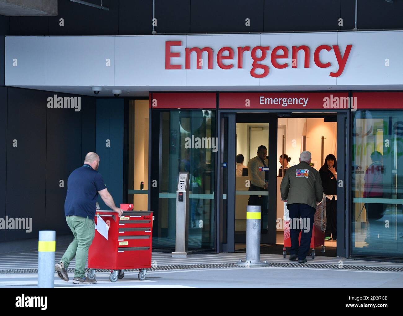 Staff move new fittings into building during the official opening of ...
