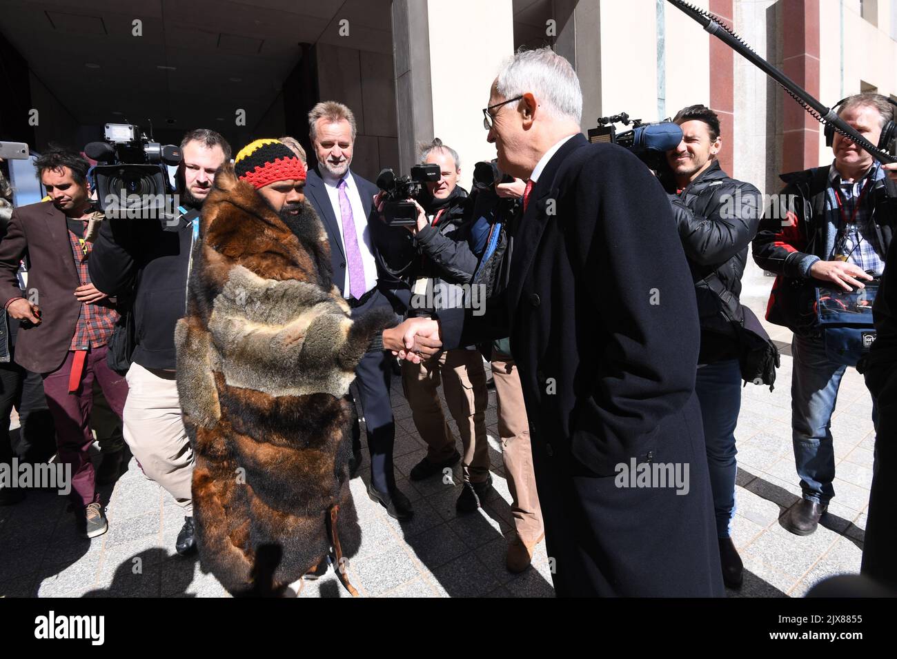 Australian Prime Minister Malcolm Turnbull (right) shakes hands with ...