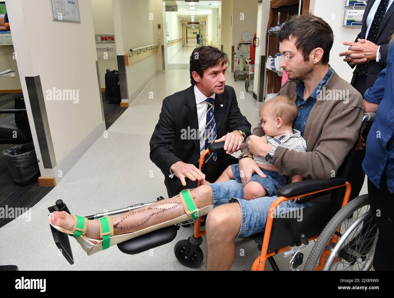 Surgeon Dr Michael Wagels (left) talks with the world's first patient ...