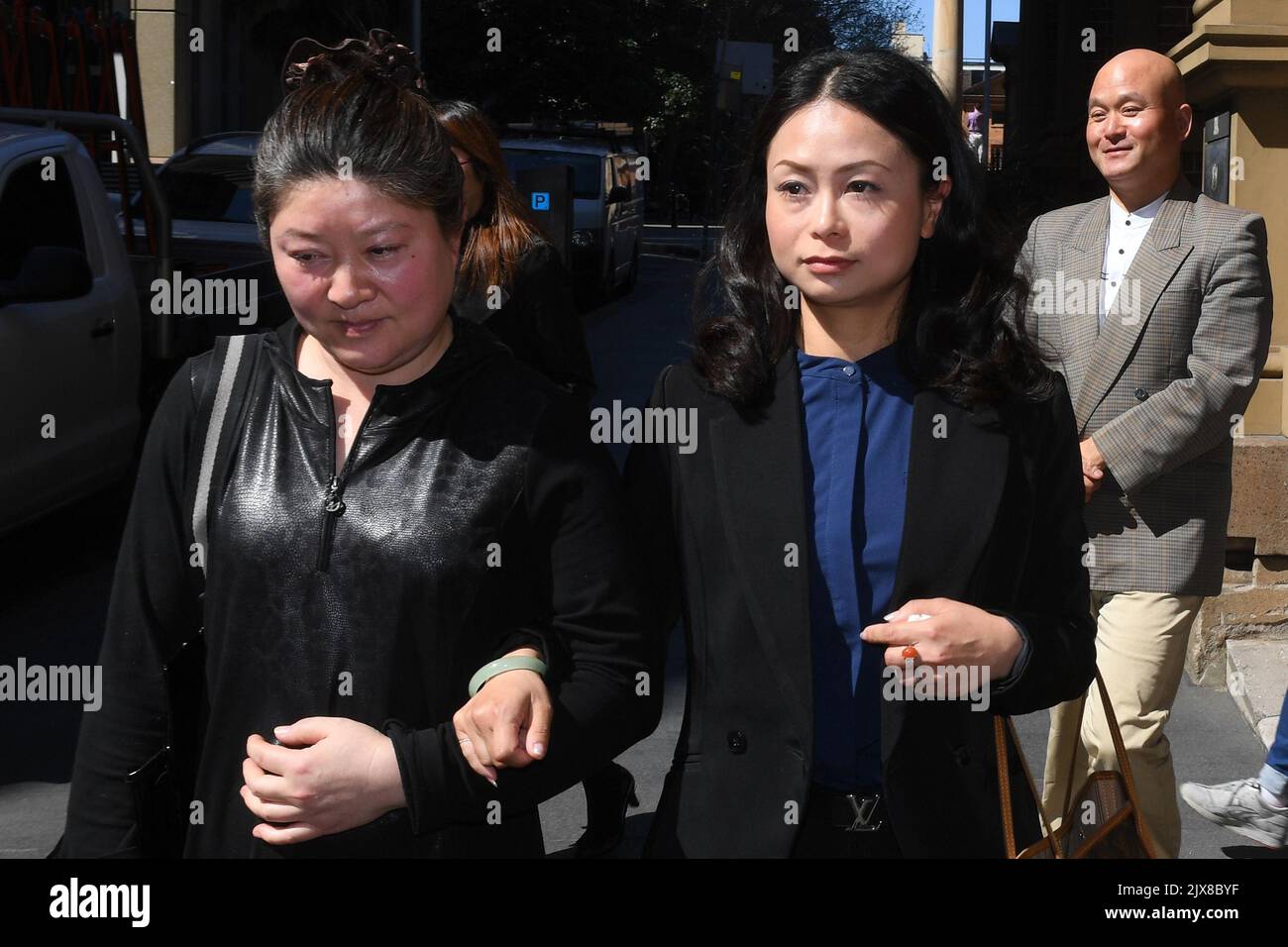 Qian Liu (centre) leaves the King Street Supreme Court with supporters ...