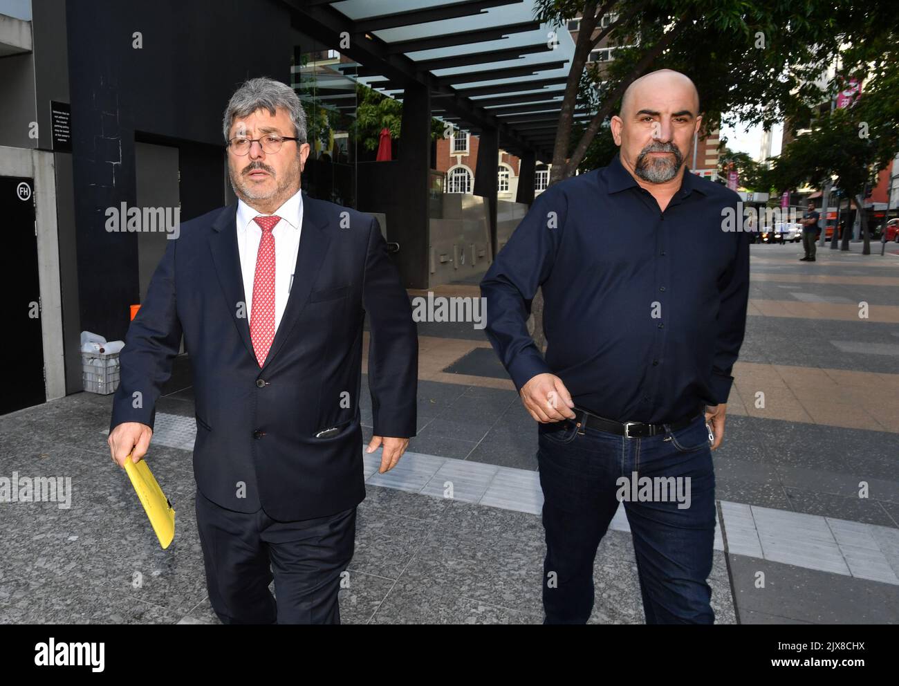 Queensland barrister Sam Di Carlo (left) leaving the Brisbane ...