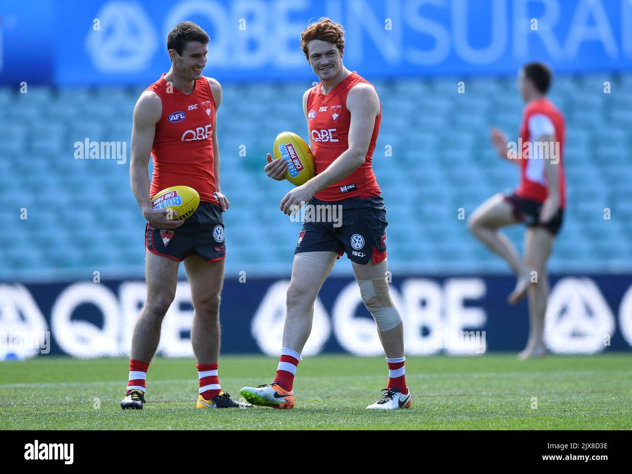 Gary Rohan of the Sydney Swans and teammate Dean Towers laugh during a ...