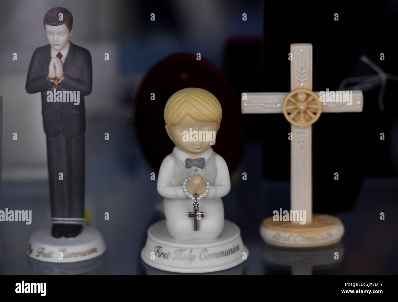 Stock images of First Holy Communion statues with boys praying and a ...