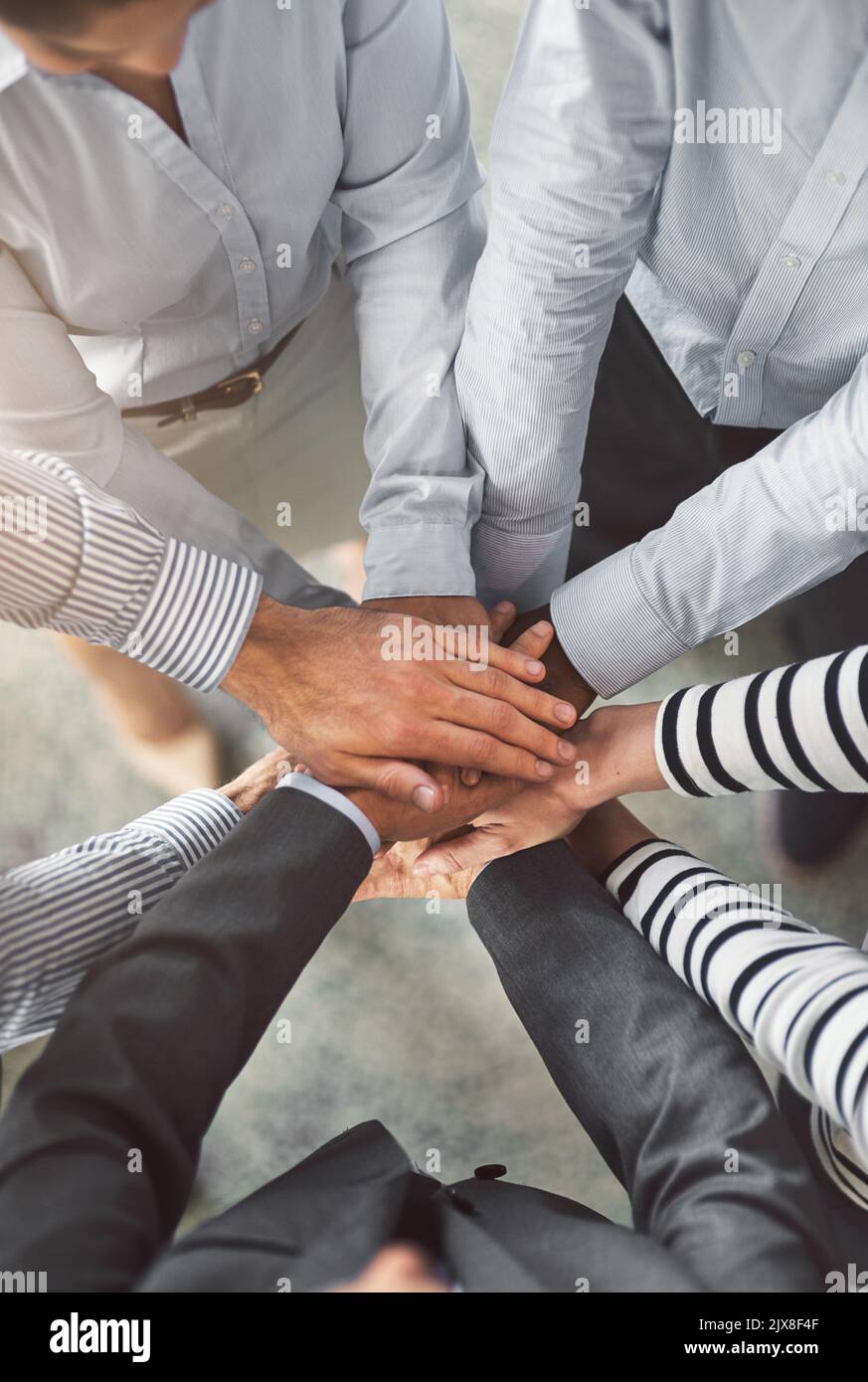 Stronger as a team. High angle shot of a group of businesspeople ...