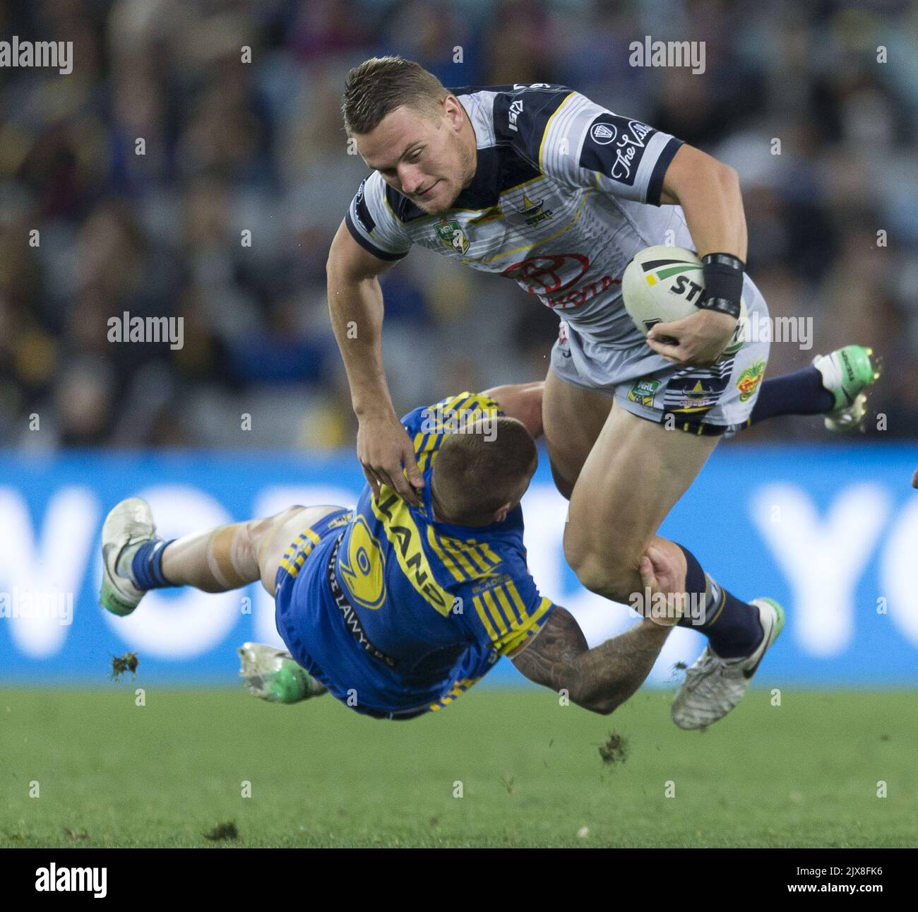 Cameron King of the Eels tackles Coen Hess of the Cowboys during the ...