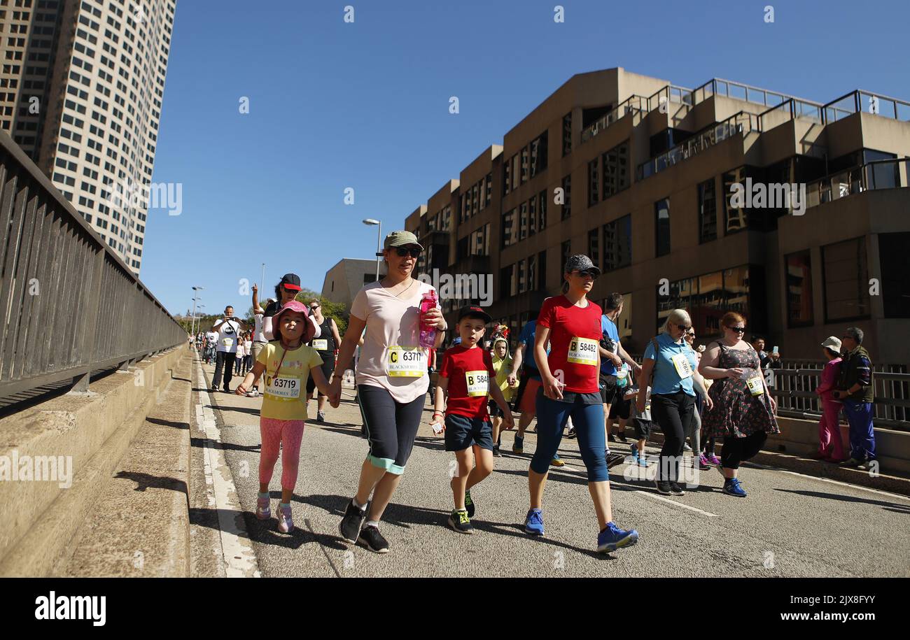Participants run during the Sydney Running Festival in Sydney, Sunday ...