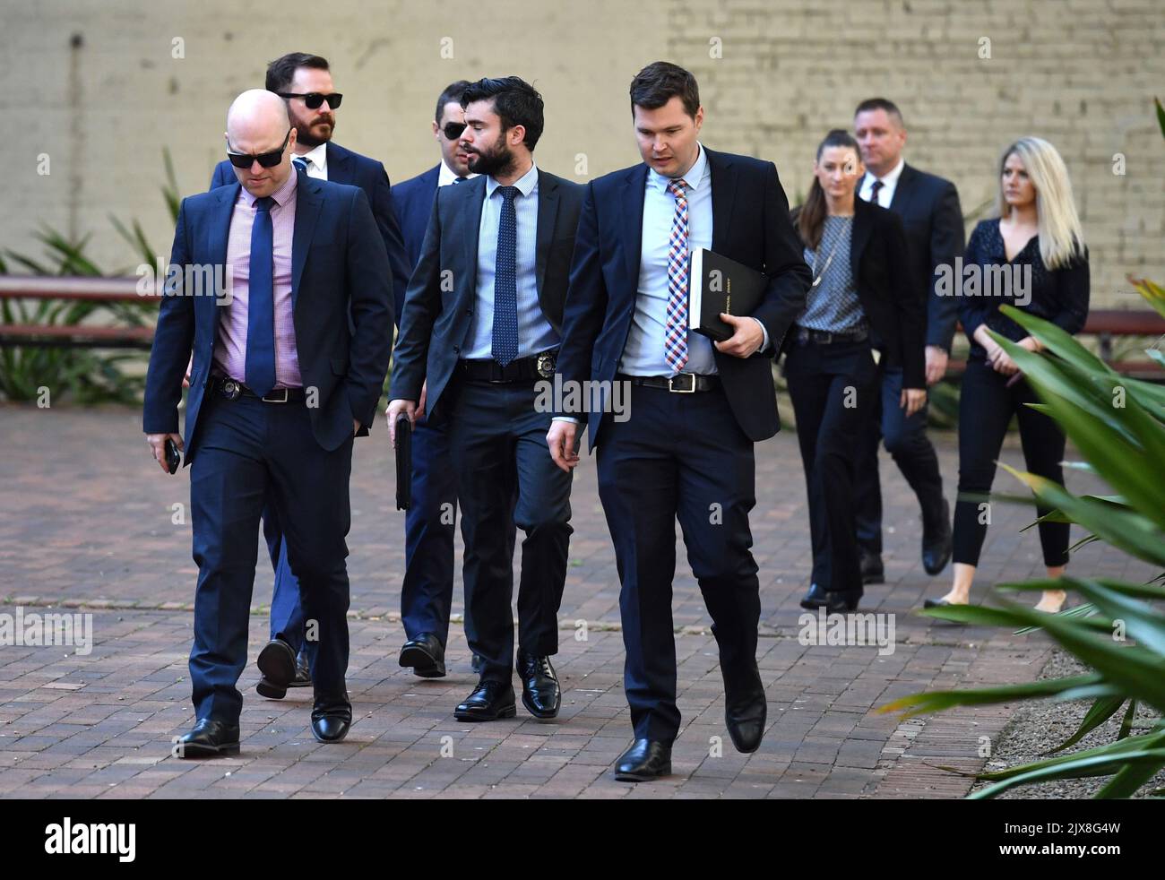 Australian Federal Police arrive for the first appearance of Michael ...