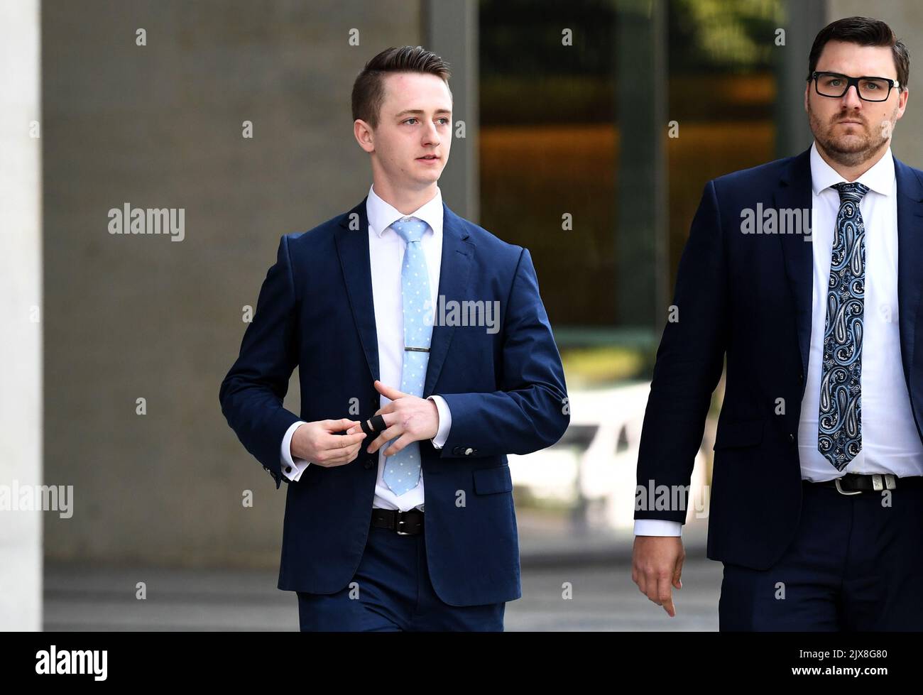 Bailey Merz (left) leaves the District Court in Brisbane, Monday ...