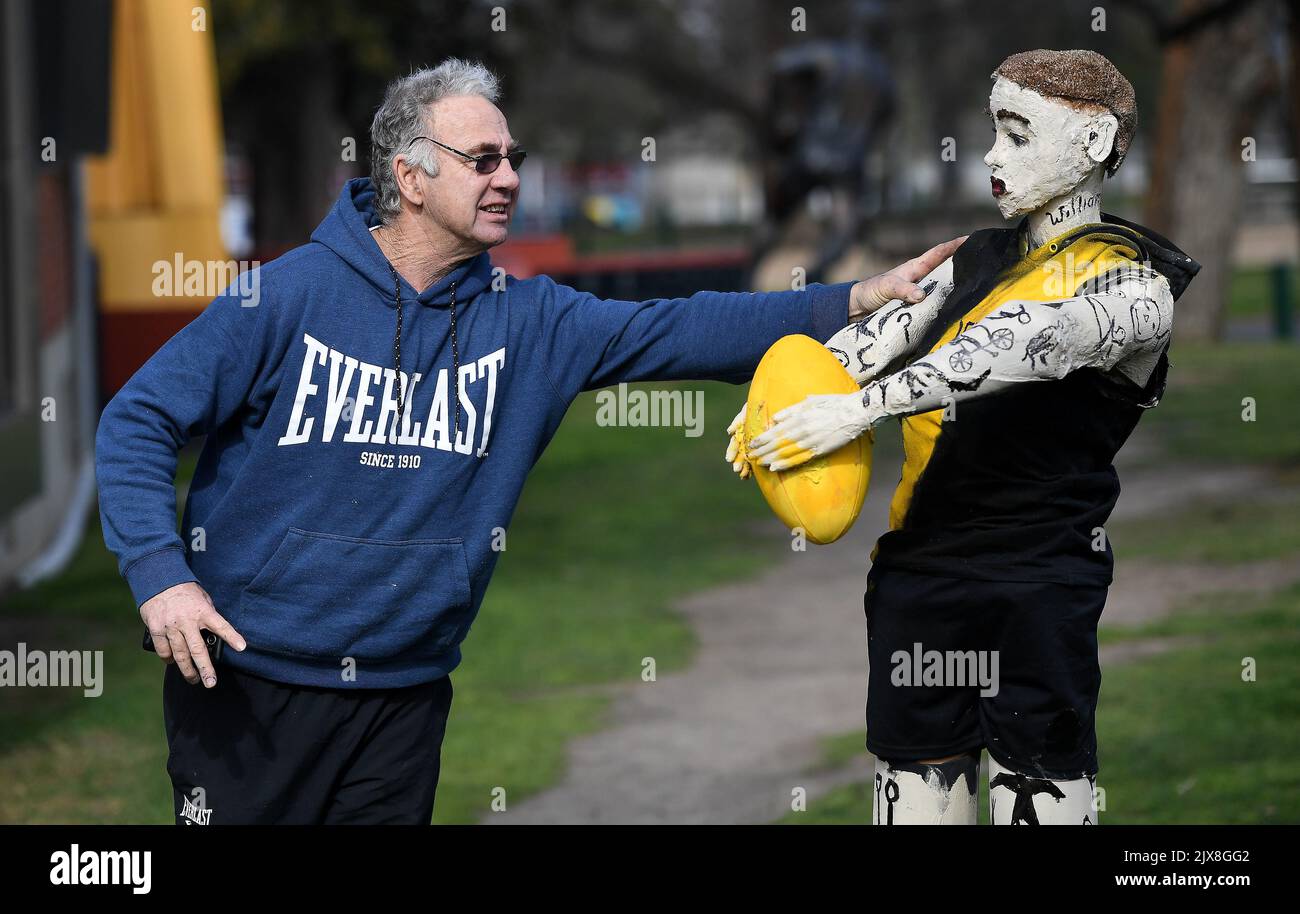 Gary "Oh My Gosh" McCosh is seen alongside a statue he made of Dustin ...