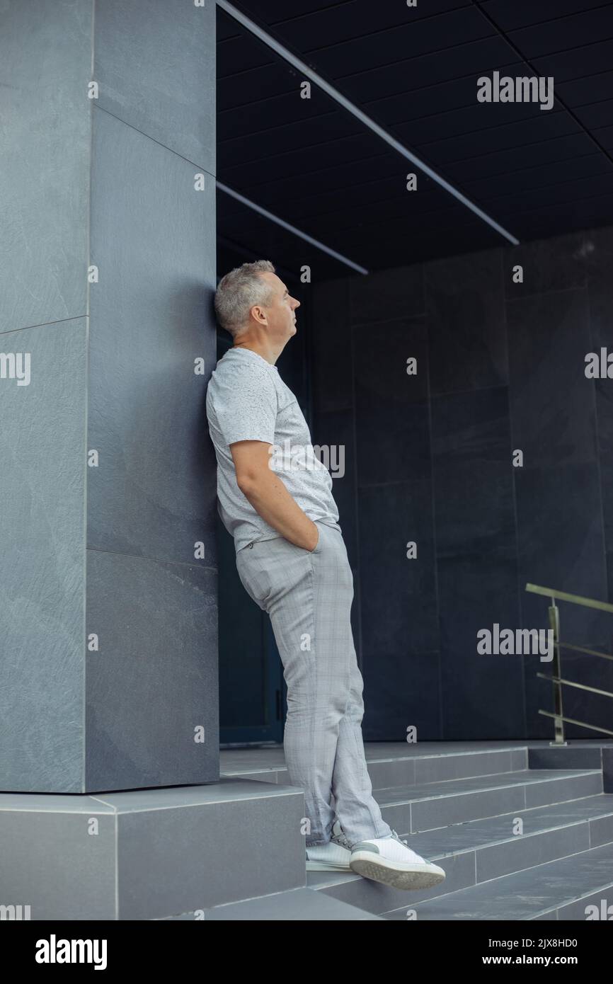 Man standing on stairs hi-res stock photography and images - Alamy