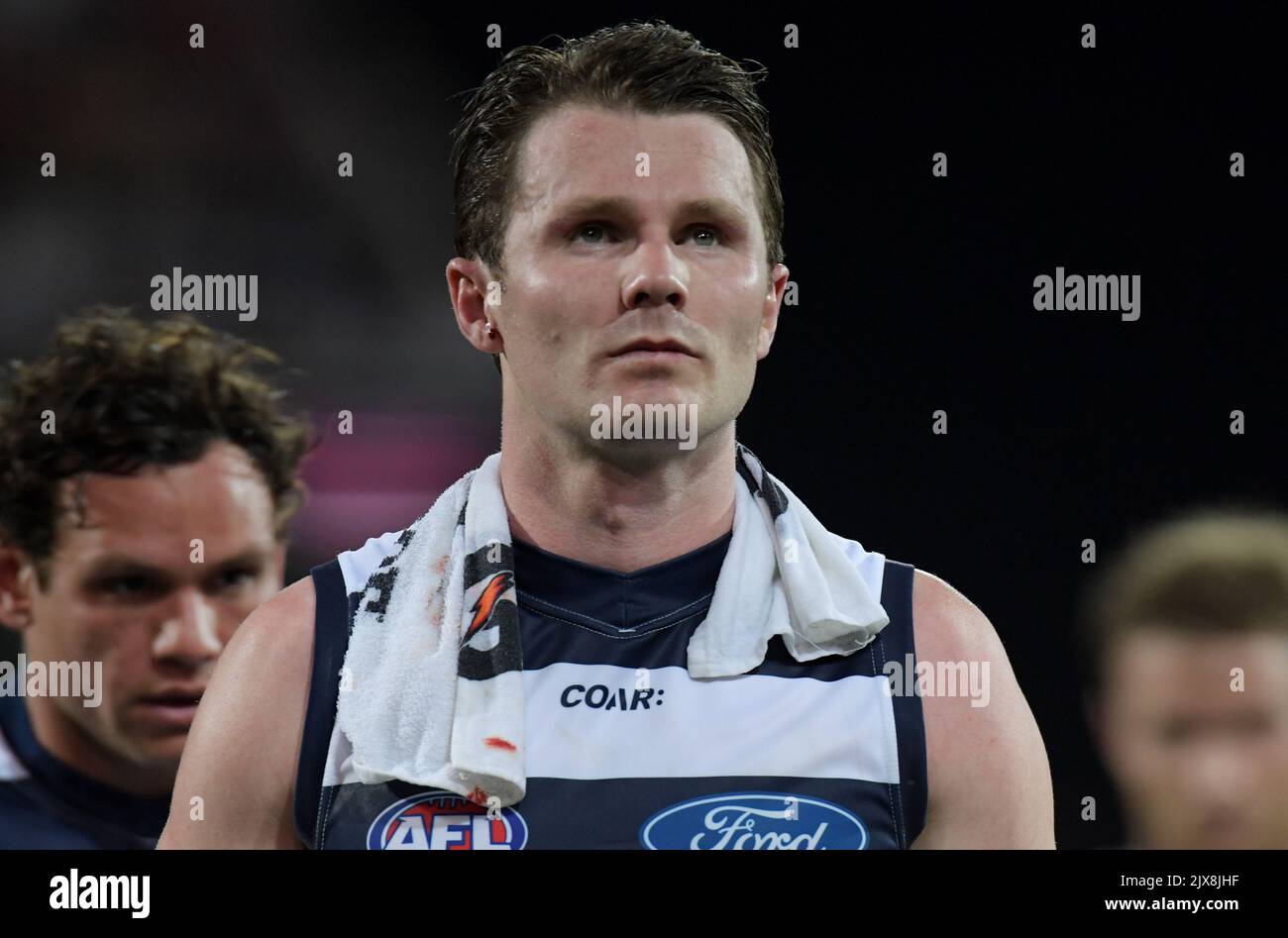 Patrick Dangerfield of the Cats walks off at half time after a ...