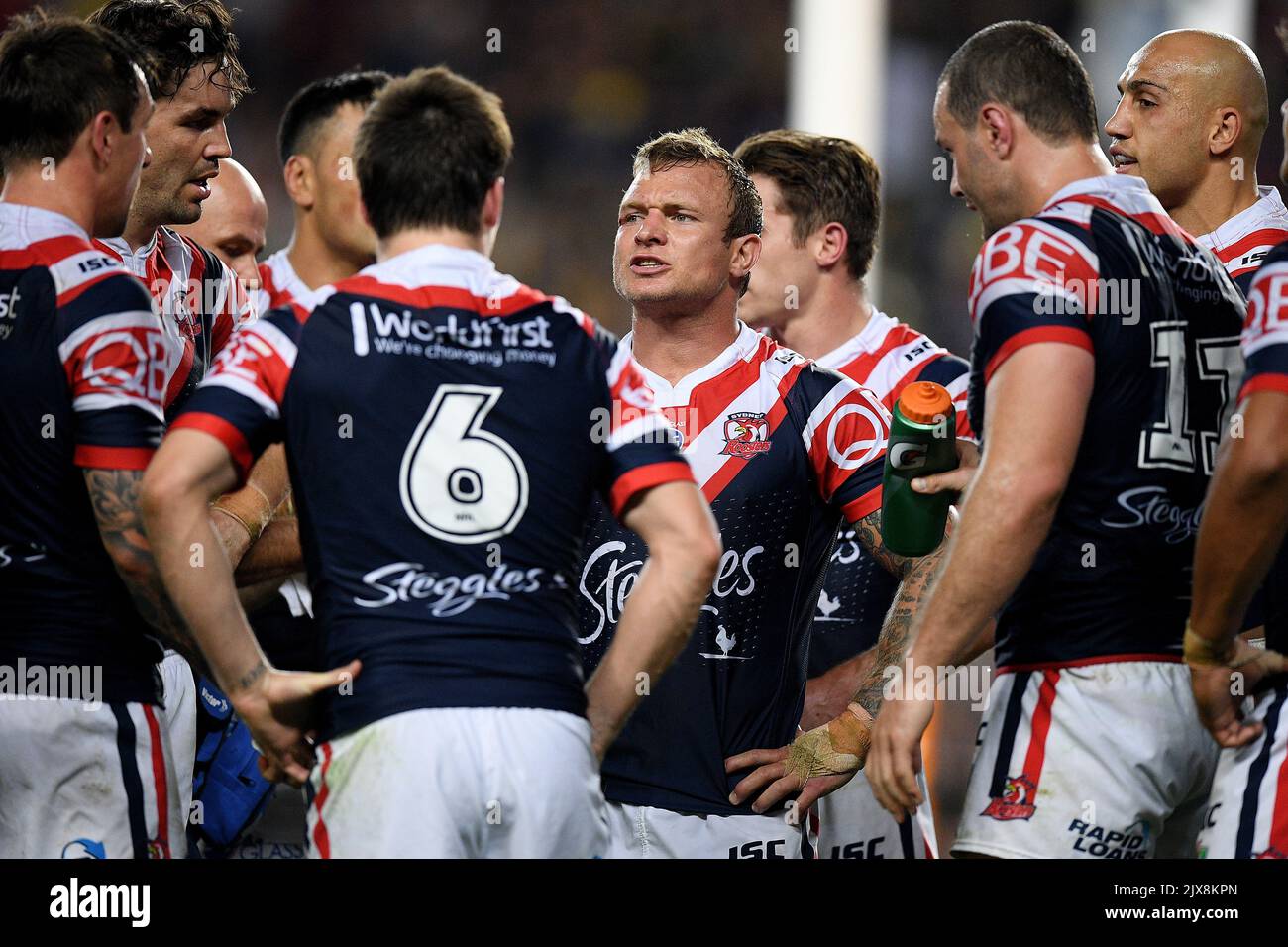 Jake Friend of the Roosters, (centre), reacts during the NRL ...