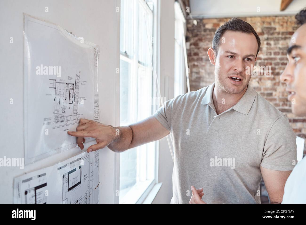 Architecture building presentation drawing, man show client blueprint ...