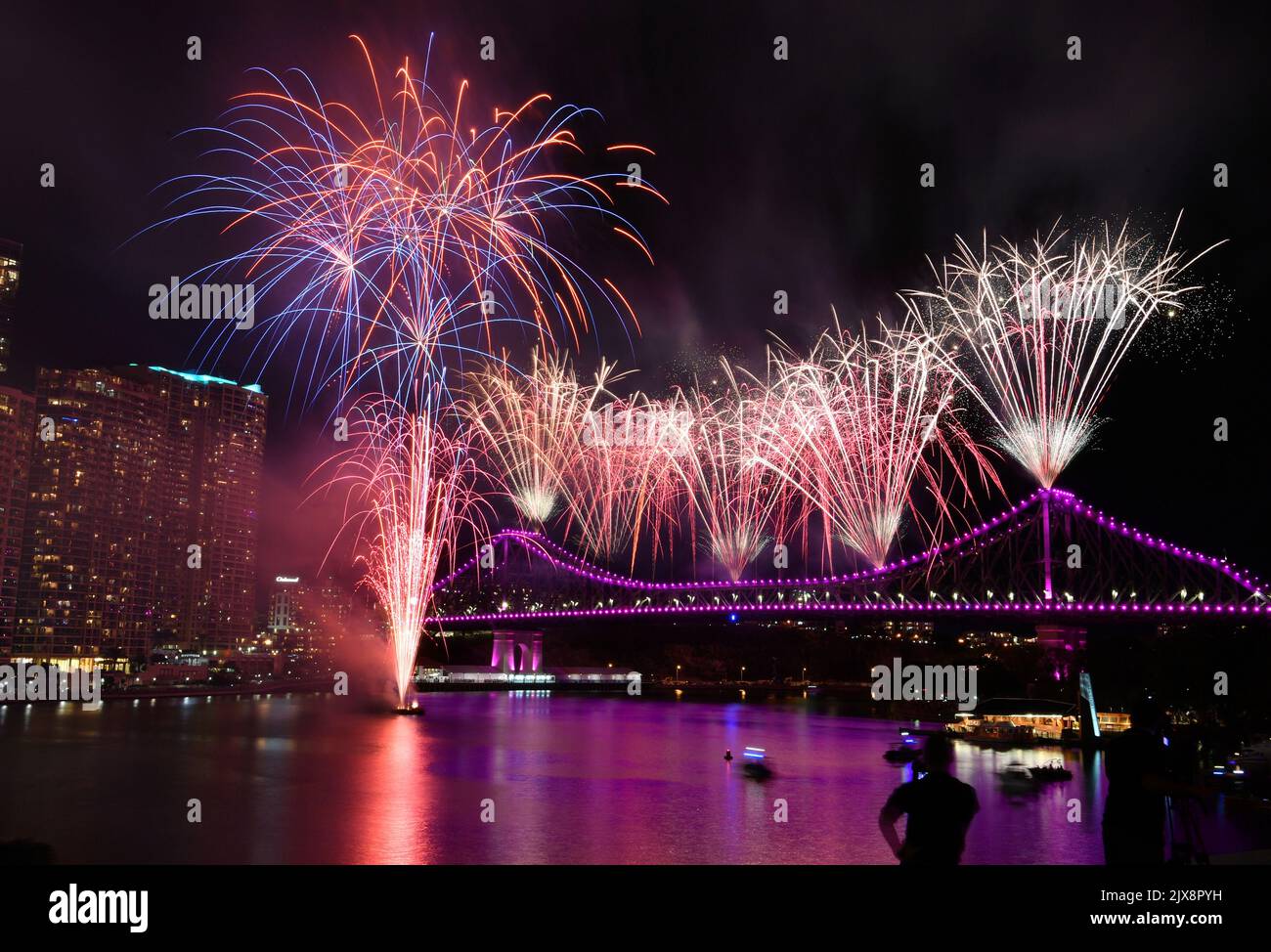 Fireworks are seen over the Story Bridge and the Brisbane skyline ...