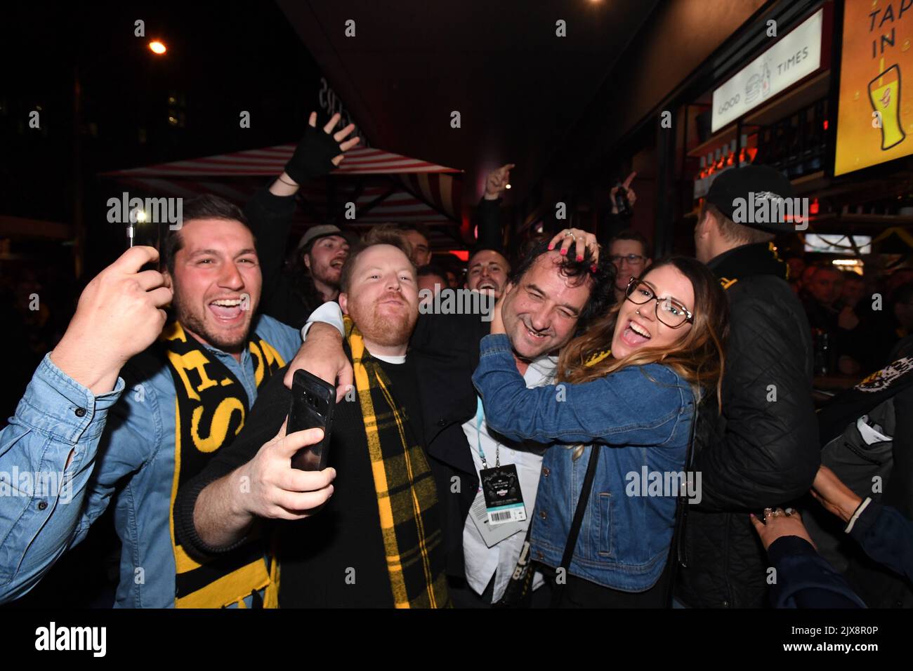 Mick Molloy (2nd from right) is seen celebrating along Swan street in ...