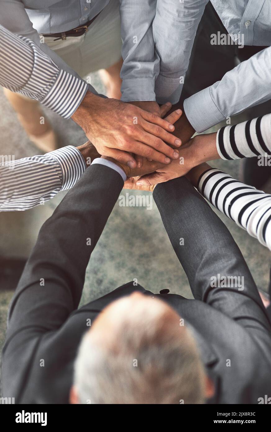 Team can do. High angle shot of a group of businesspeople standing in a ...