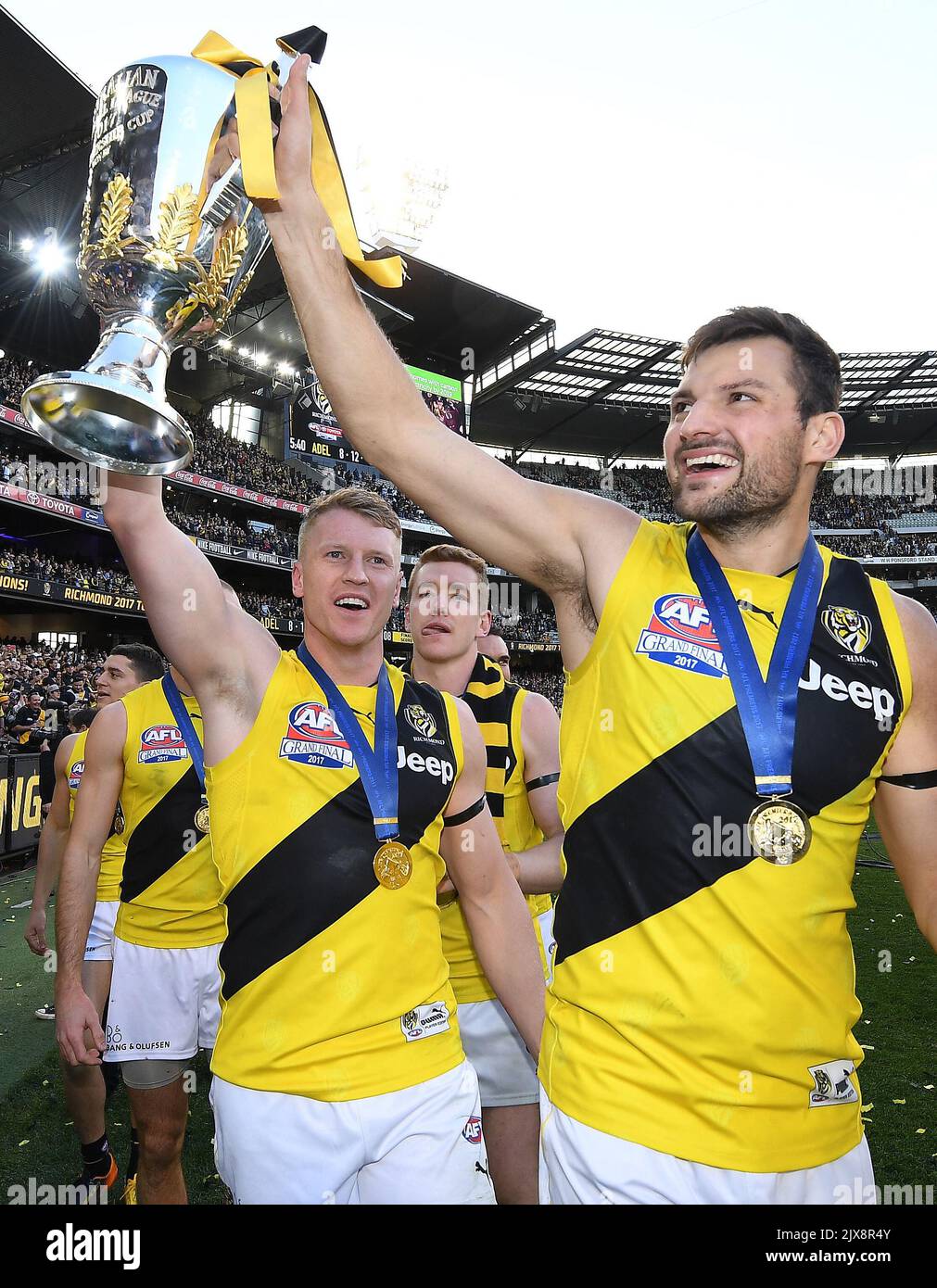 Josh Caddy (left) and Toby Nankervis of the Tigers hold the premiership ...