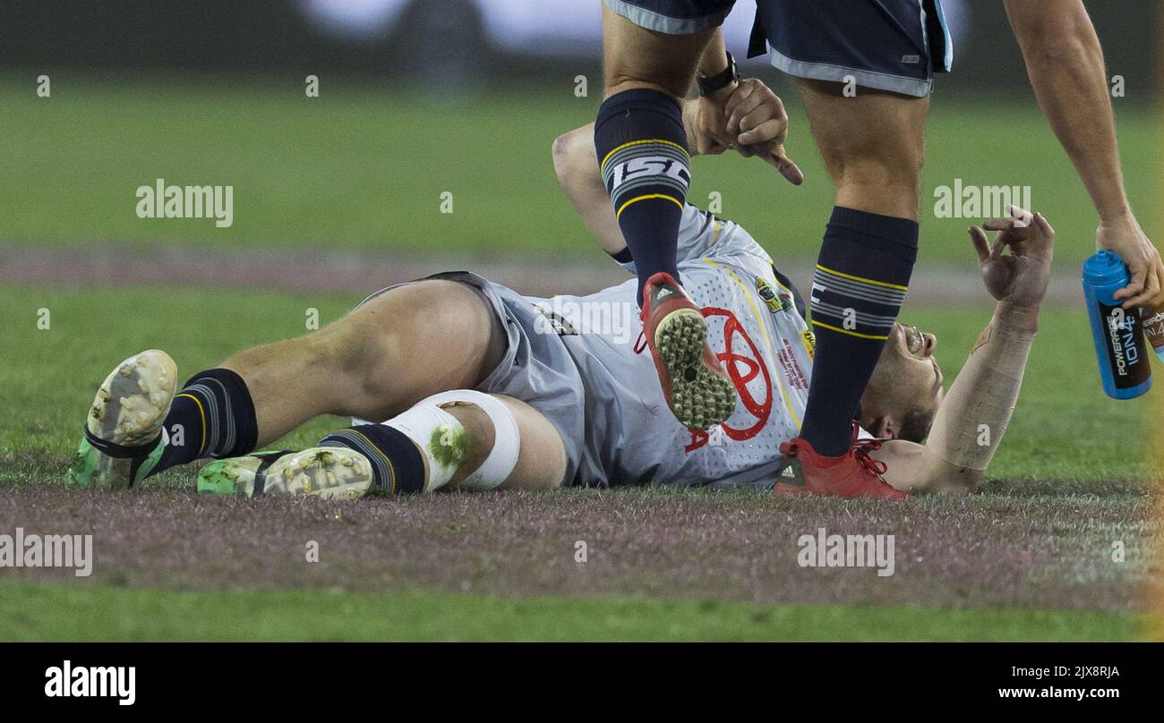 Shaun Fensom of the Cowboys is injured during the NRL grand final ...
