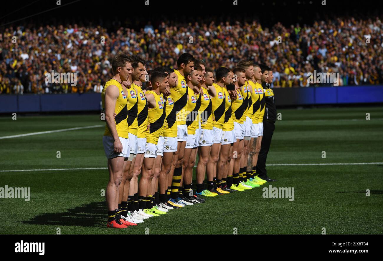 The Tigers players and coach Damien Hardwick (right) are during the ...