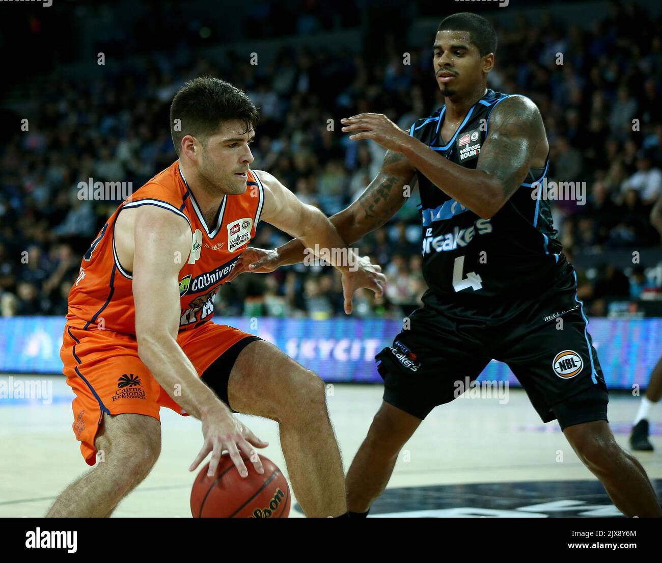 Stephen Weigh of the Taipans (left) is challenged by Edgar Sosa of the ...