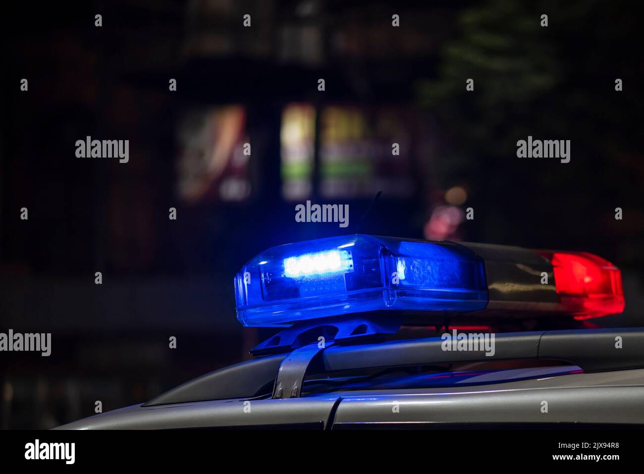 Emergency light of police patrolling car on street in night Stock Photo ...
