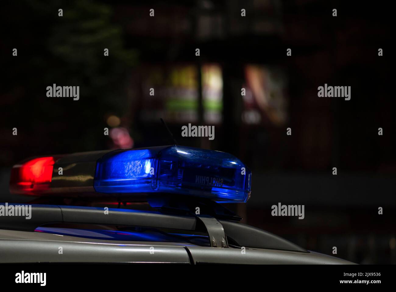Emergency light of police patrolling car on street in night Stock Photo ...