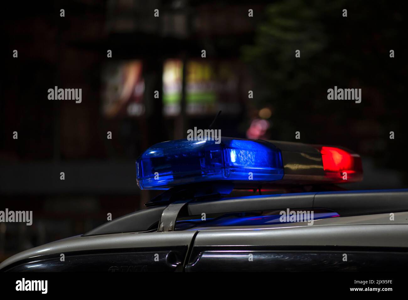 Emergency light of police patrolling car on street in night Stock Photo ...