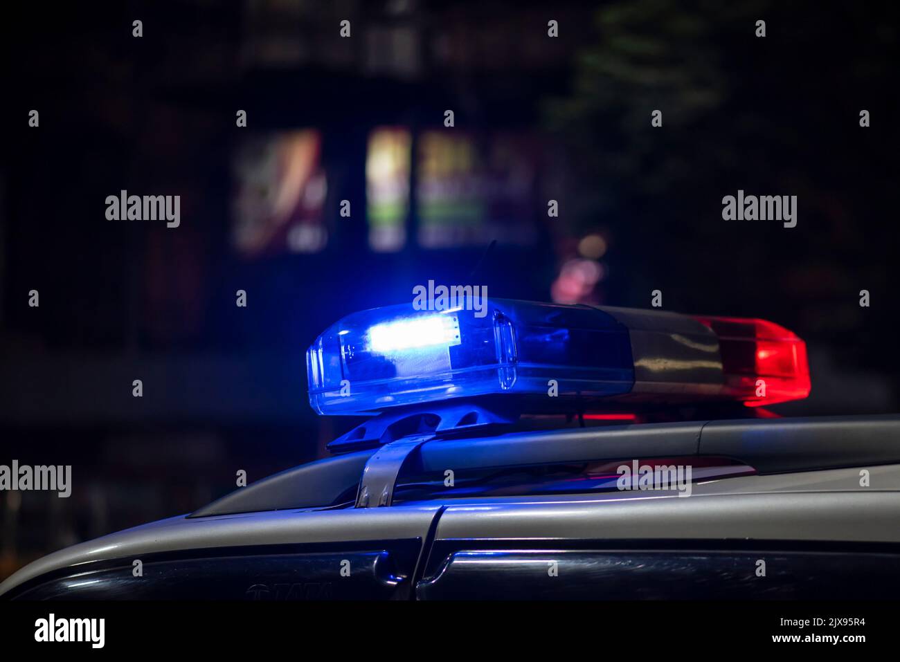 Emergency light of police patrolling car on street in night Stock Photo ...