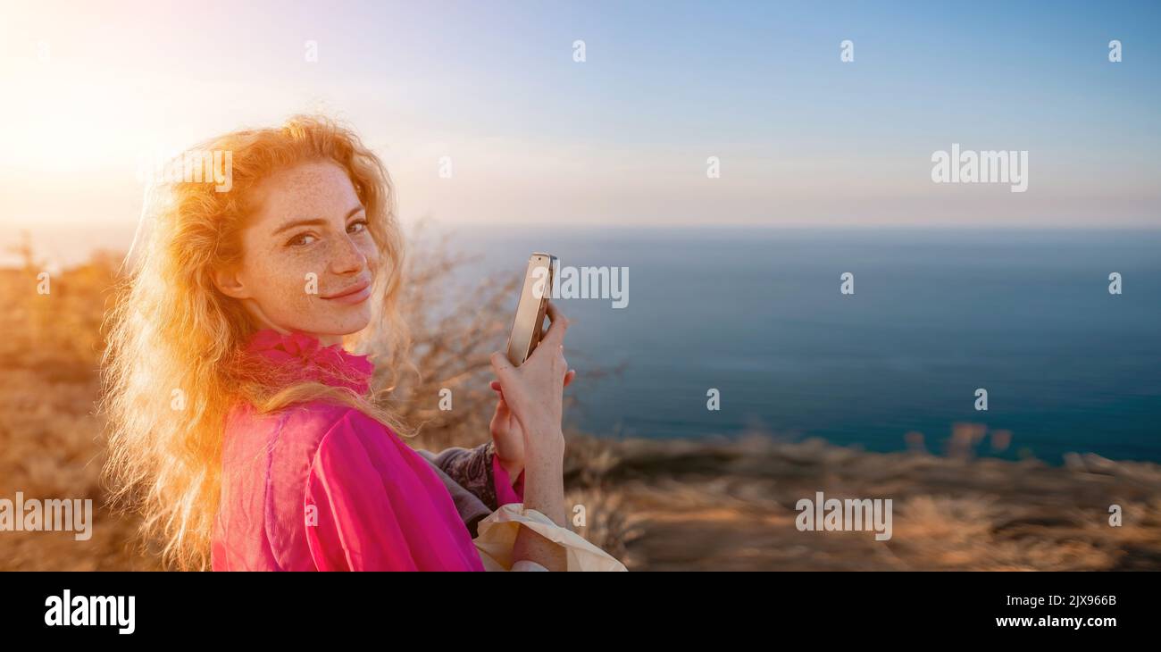 Close up portrait of curly redhead young caucasian woman with freckles ...