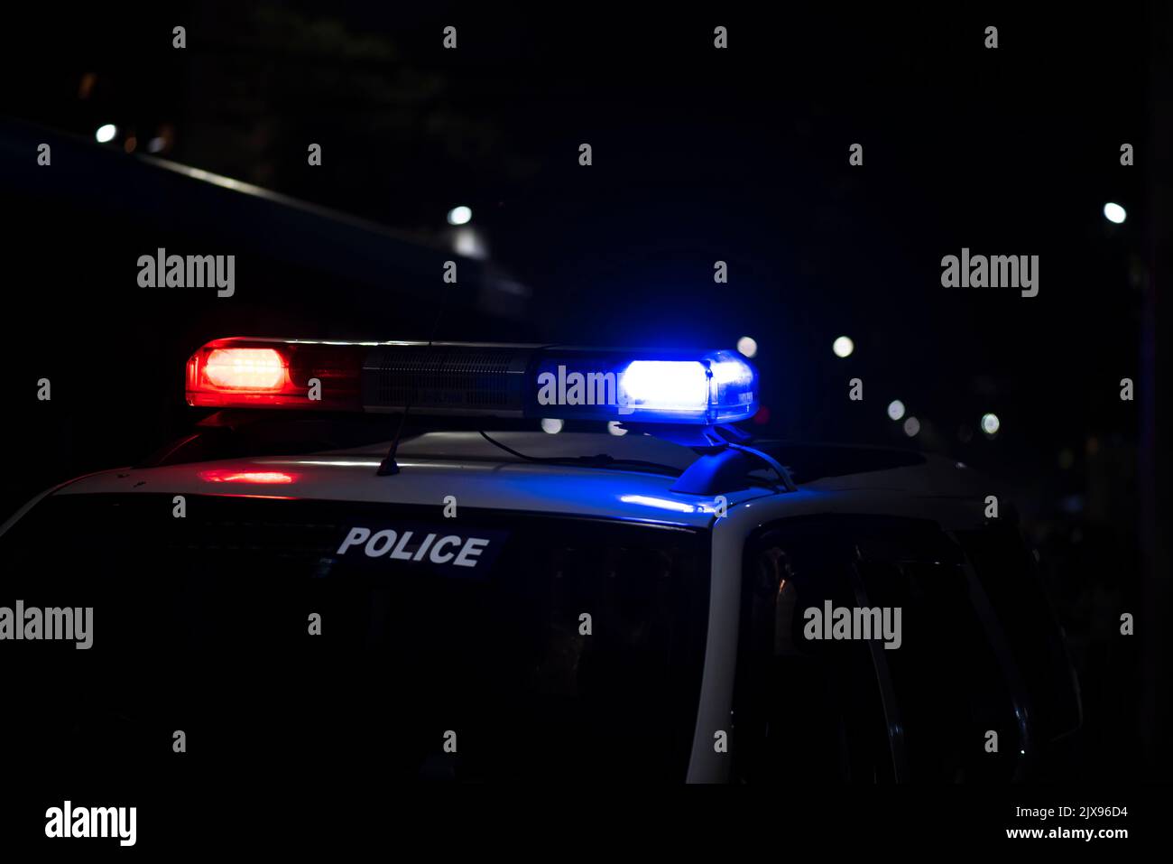 Emergency light of police patrolling car on street in night Stock Photo ...
