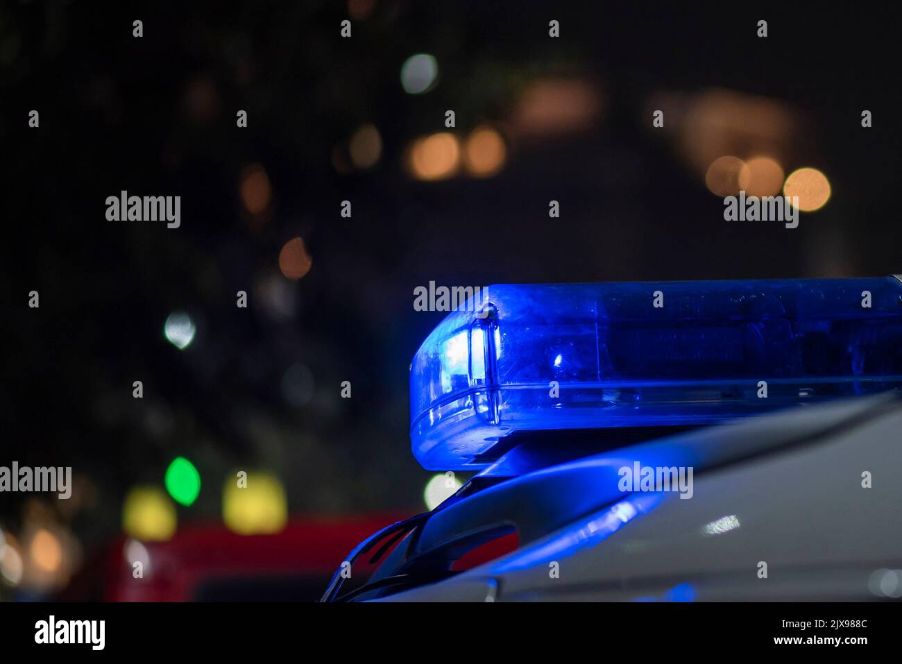 Emergency light of police patrolling car on street in night Stock Photo ...