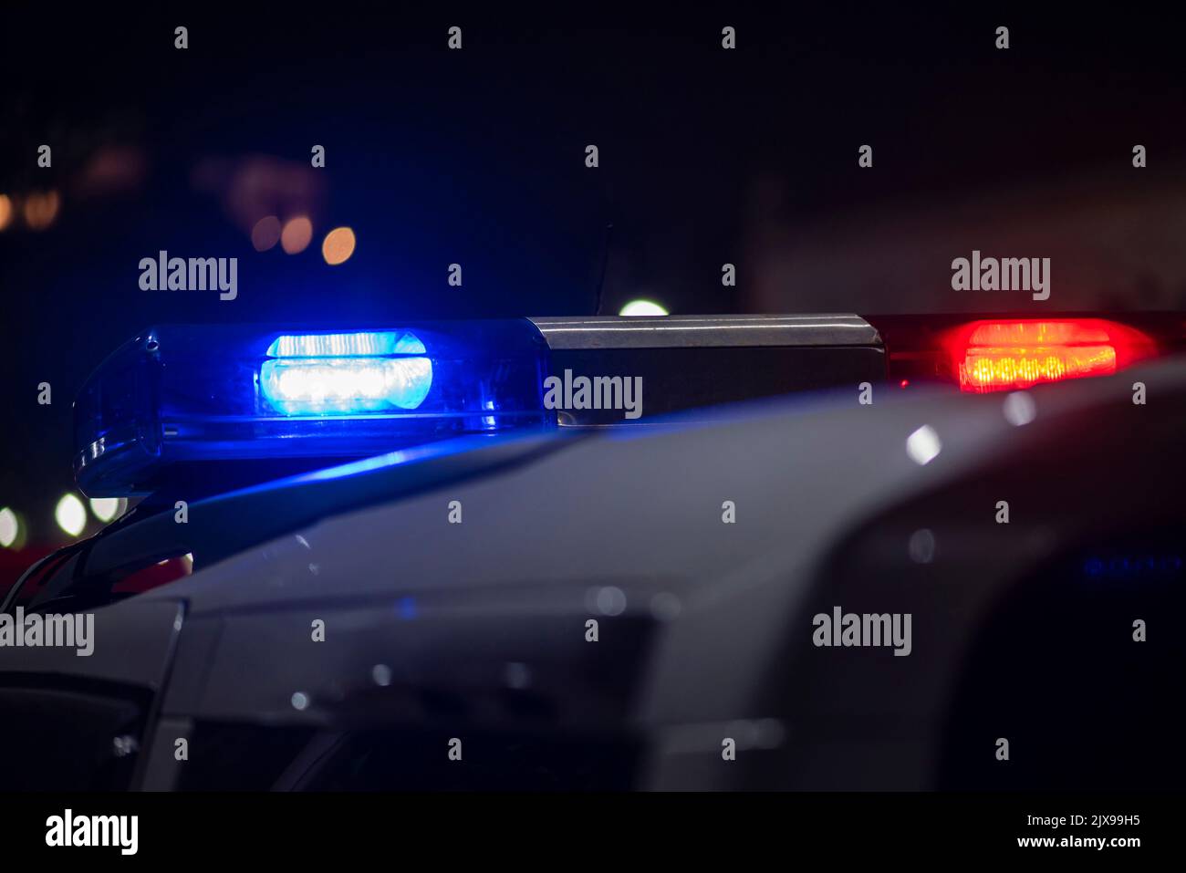 Emergency light of police patrolling car on street in night Stock Photo ...
