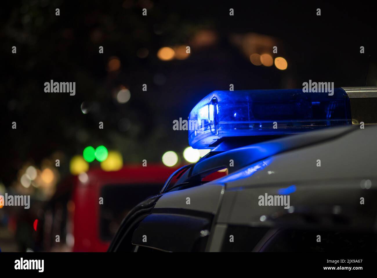 Emergency light of police patrolling car on street in night Stock Photo ...