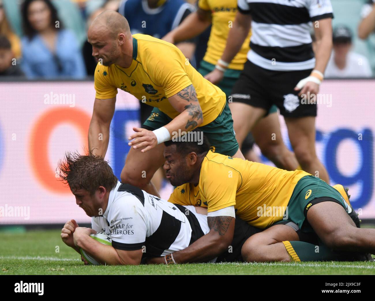 Andrew Ready of the Barbarians scores a try during the rugby match ...