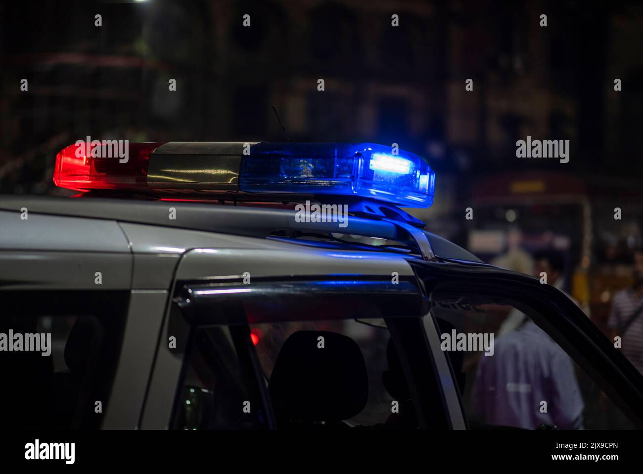 Emergency light of police patrolling car on street in night Stock Photo ...