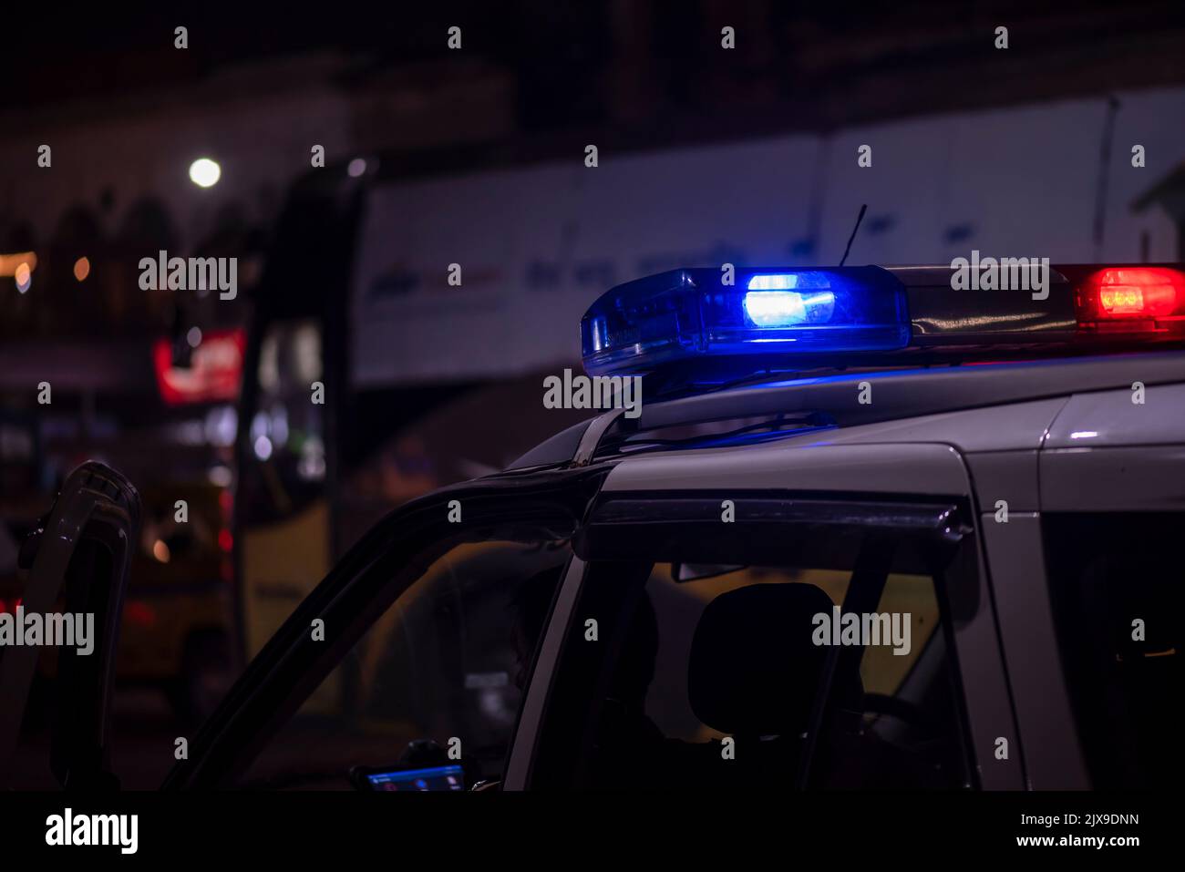 Emergency light of police patrolling car on street in night Stock Photo ...
