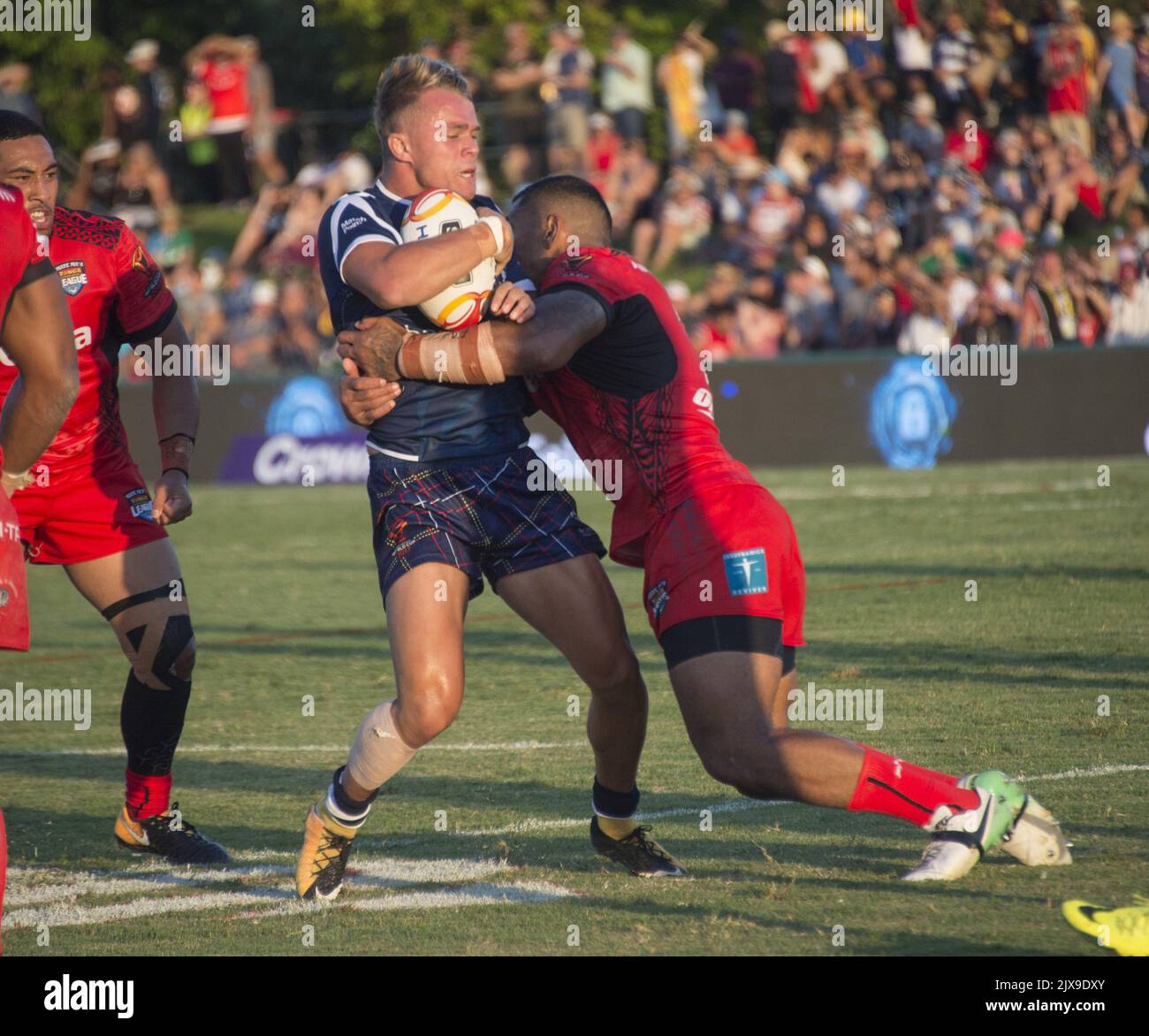 Scotland's Lewis Tierney is tackled during the World Cup Rugby League ...
