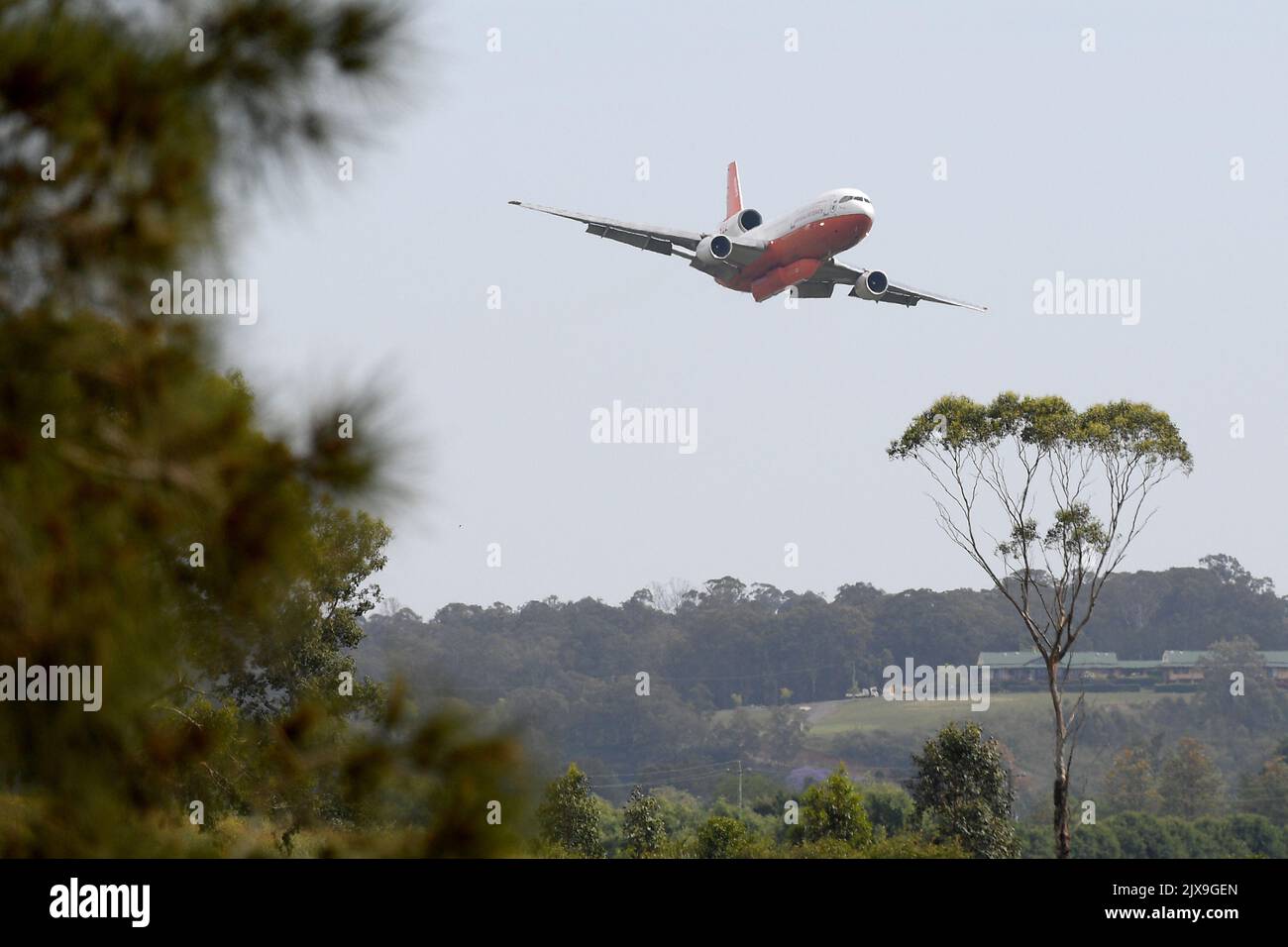 A NSW Rural Fire Service Very Large Air Tanker (VLAT) is seen on a low ...