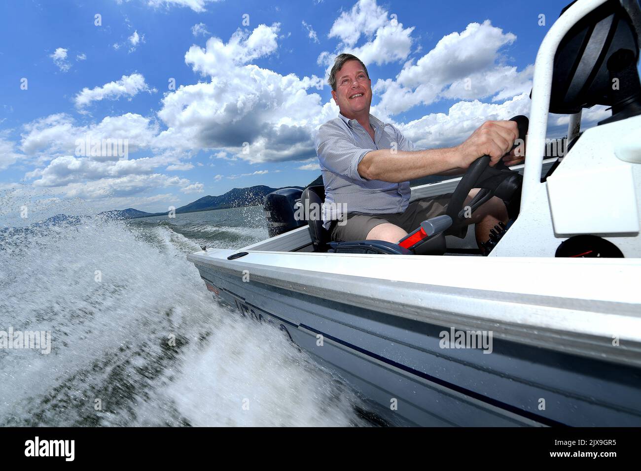 Queensland LNP leader Tim Nicholls drives a boat on the Peter Faust Dam ...