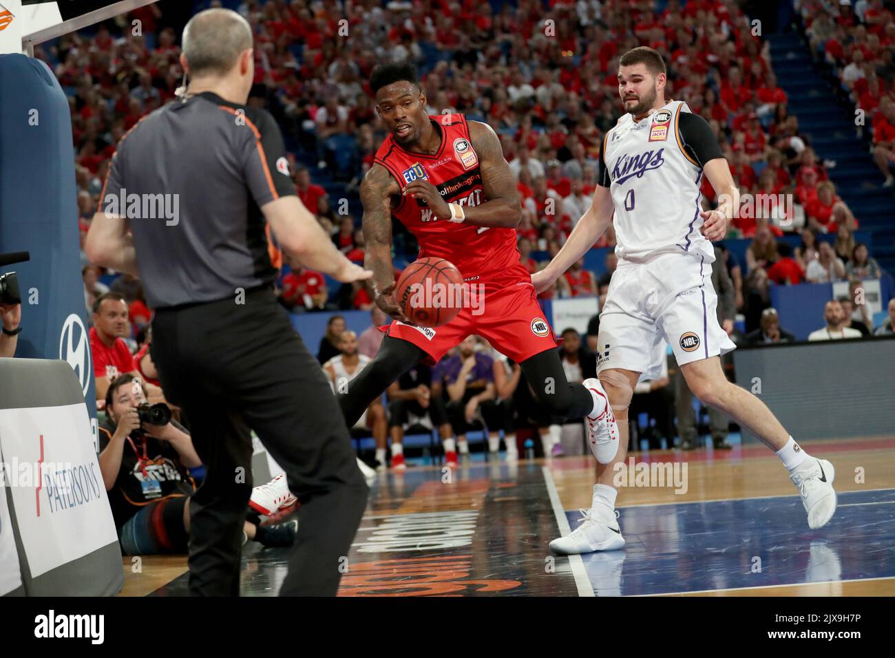 Derek Cooke of the Wildcats tries to keep the ball in play during the ...