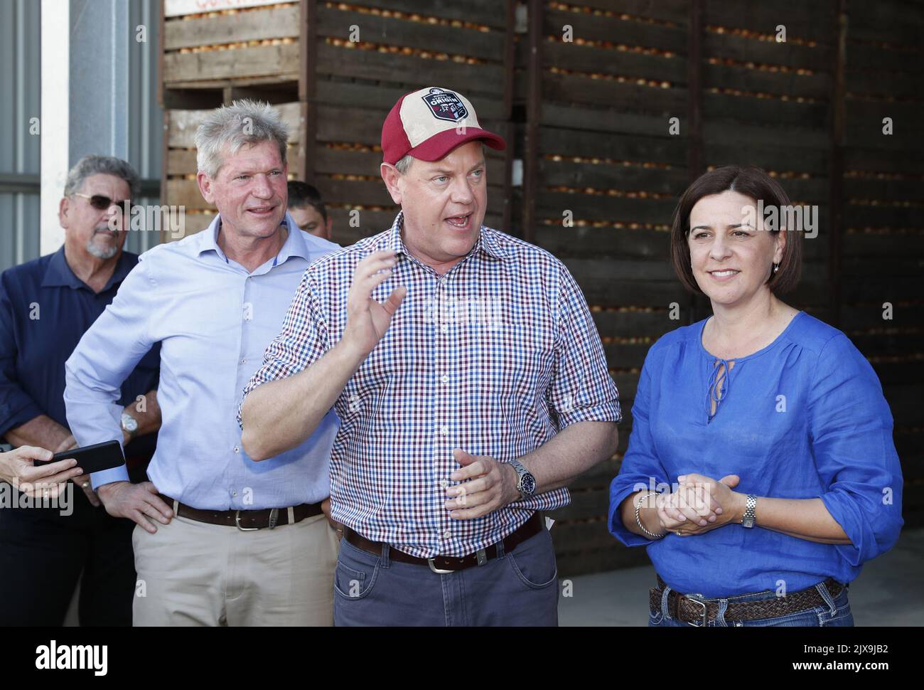 Queensland LNP leader Tim Nicholls flanked by local LNP candidate Jim ...