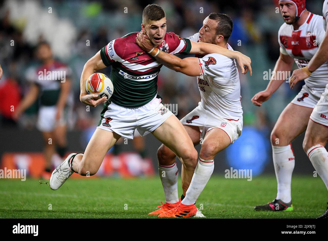 Adam Doueihi of Lebanon is tackled by Josh Hodgson of England during ...