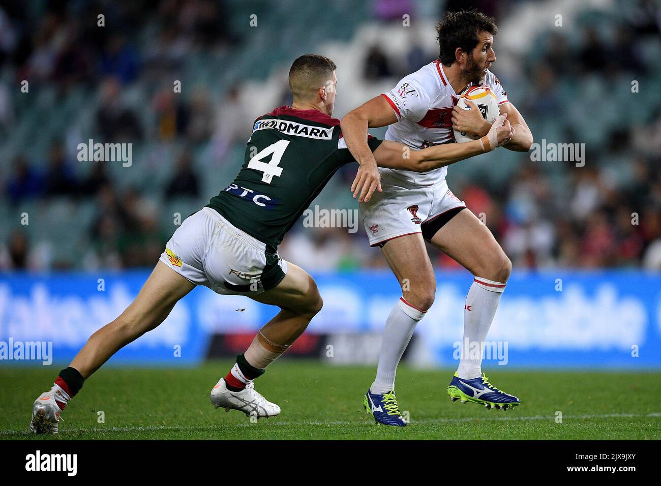 Stefan Ratchford of England is tackled by Adam Doueihi of Lebanon ...