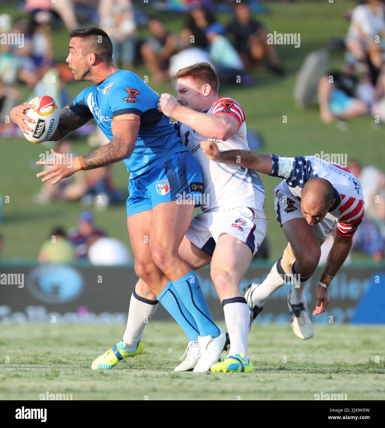 Paul Vaughan of Italy tackled by USA Captain Mark Offerdahl (left) and ...