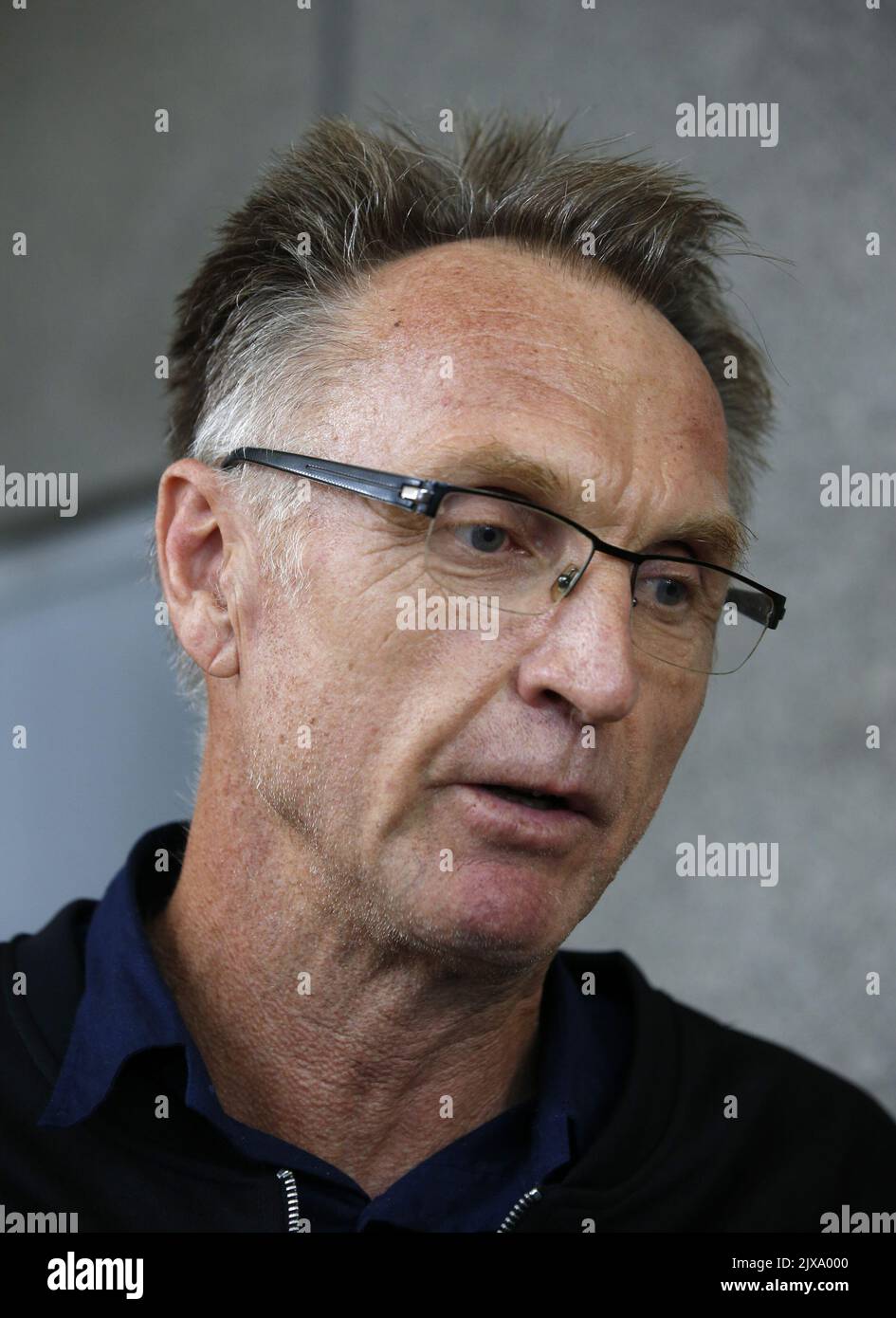 Former Olympic swimmer Neil Brooks talks to the media outside a watch ...