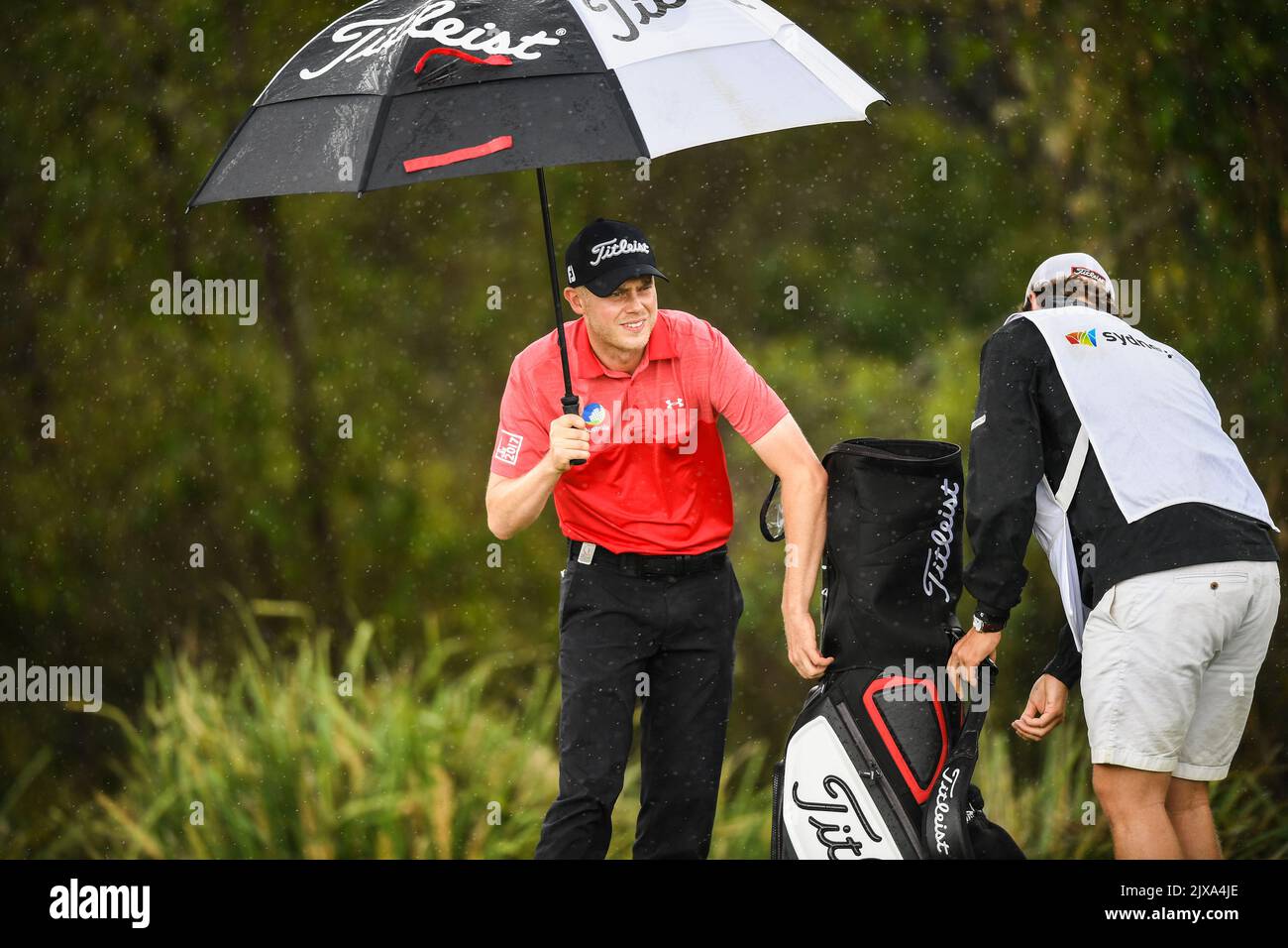 Victorian golfer Ben Eccles in the rain during day 3 of the NSW Open Golf Championships at Twin ...
