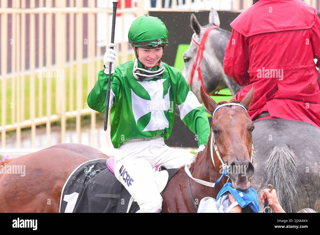 Jockey Zoe White gestures after riding Bring It Home Pop to win race 5 ...