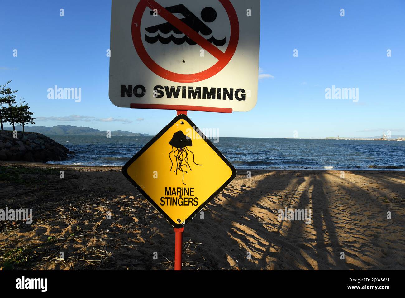A marine stinger warning sign is seen at a beach in Townsville in far ...