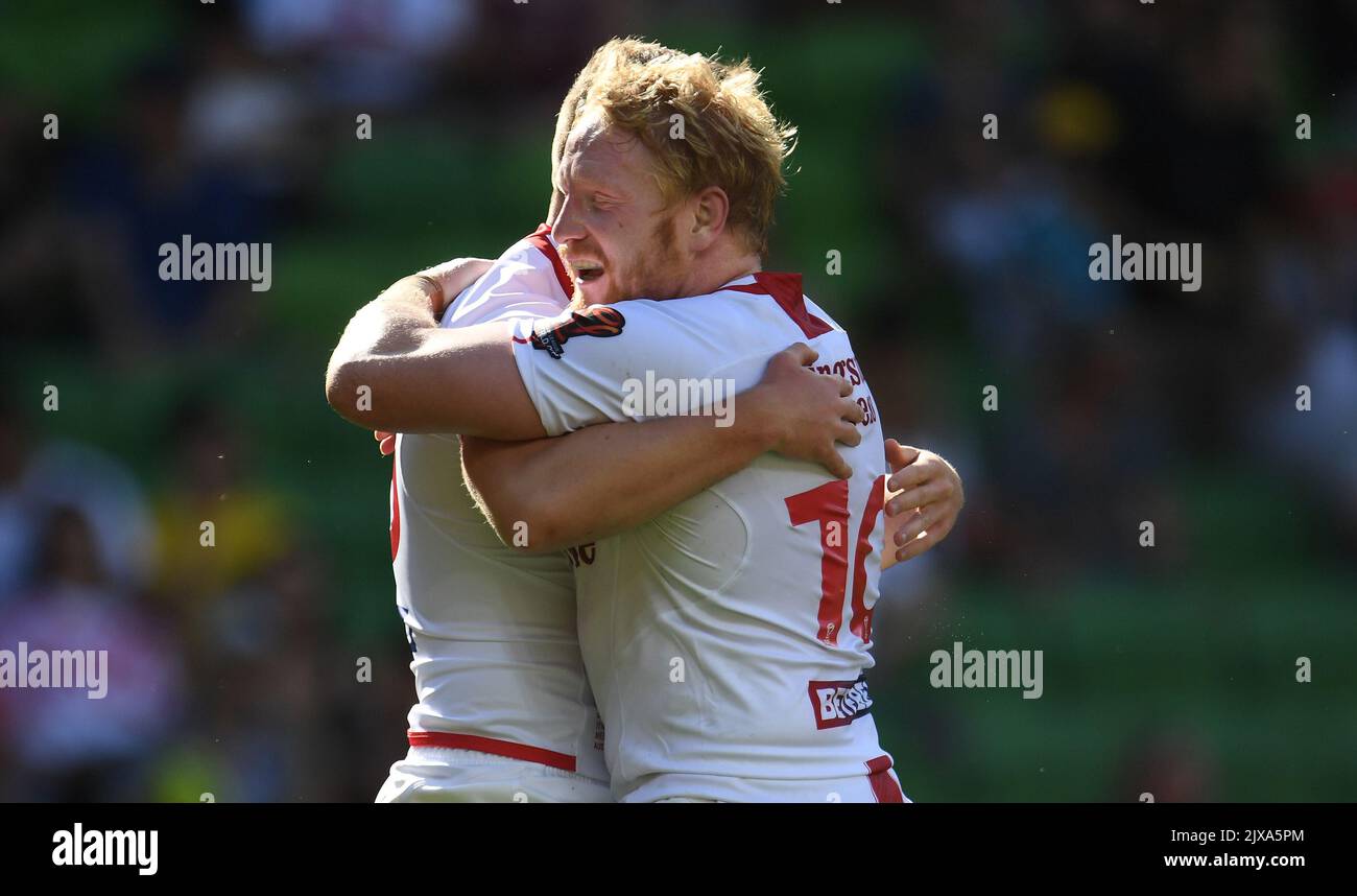 Ben Currie (left) and James Graham of England react after Currie scored ...