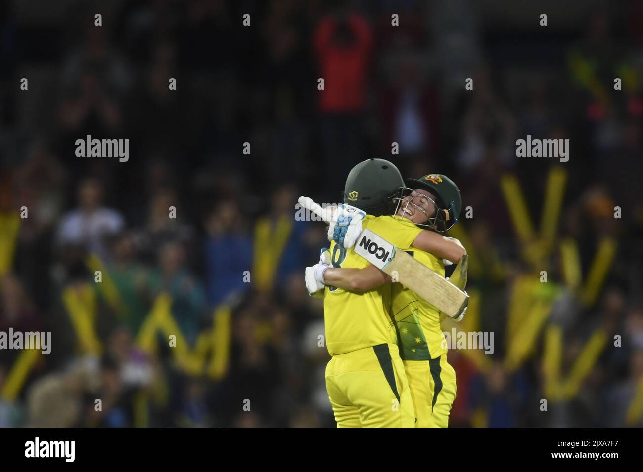 Beth Mooney of Australia celebrates her century with team mate Elise ...